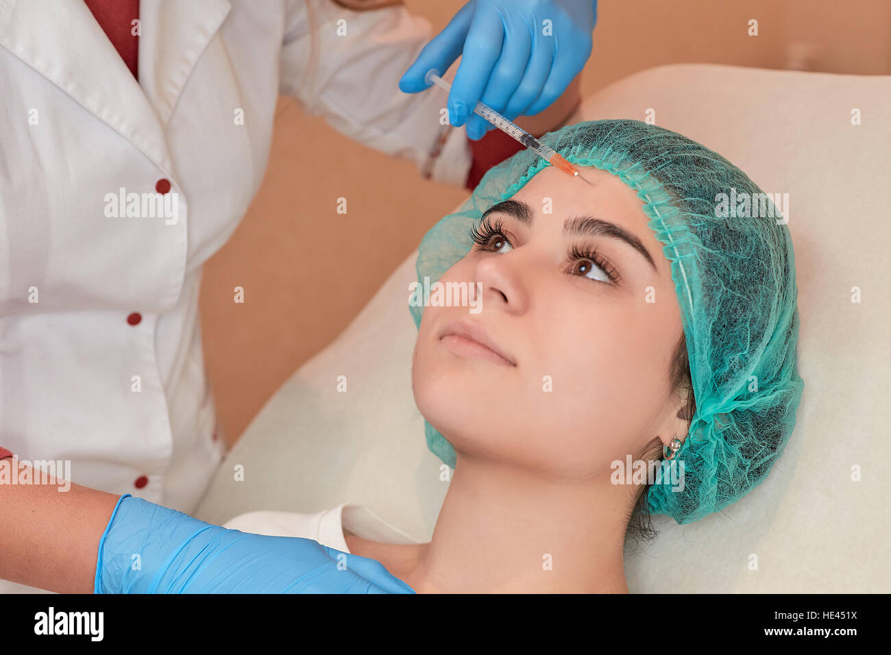 Beautiful woman gets injections Stock Photo - Alamy
