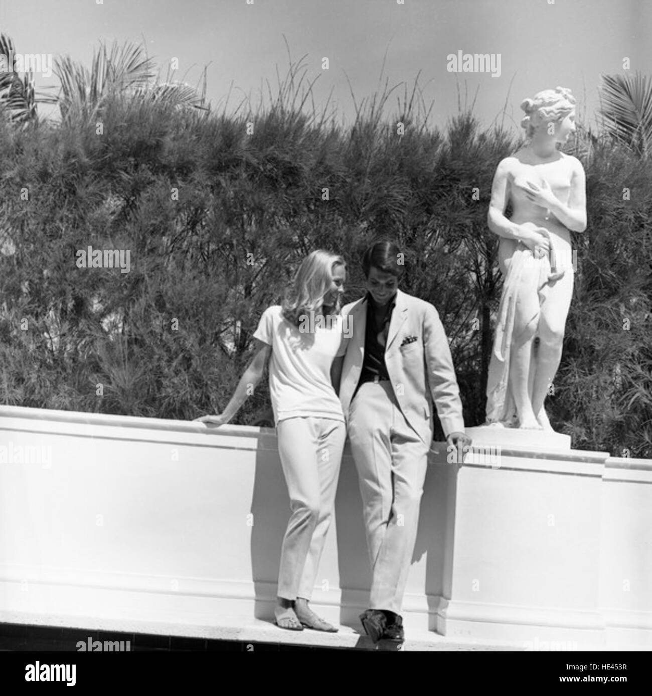 Model Sunny Bippus is pictured alongside actor George Hamilton in ...