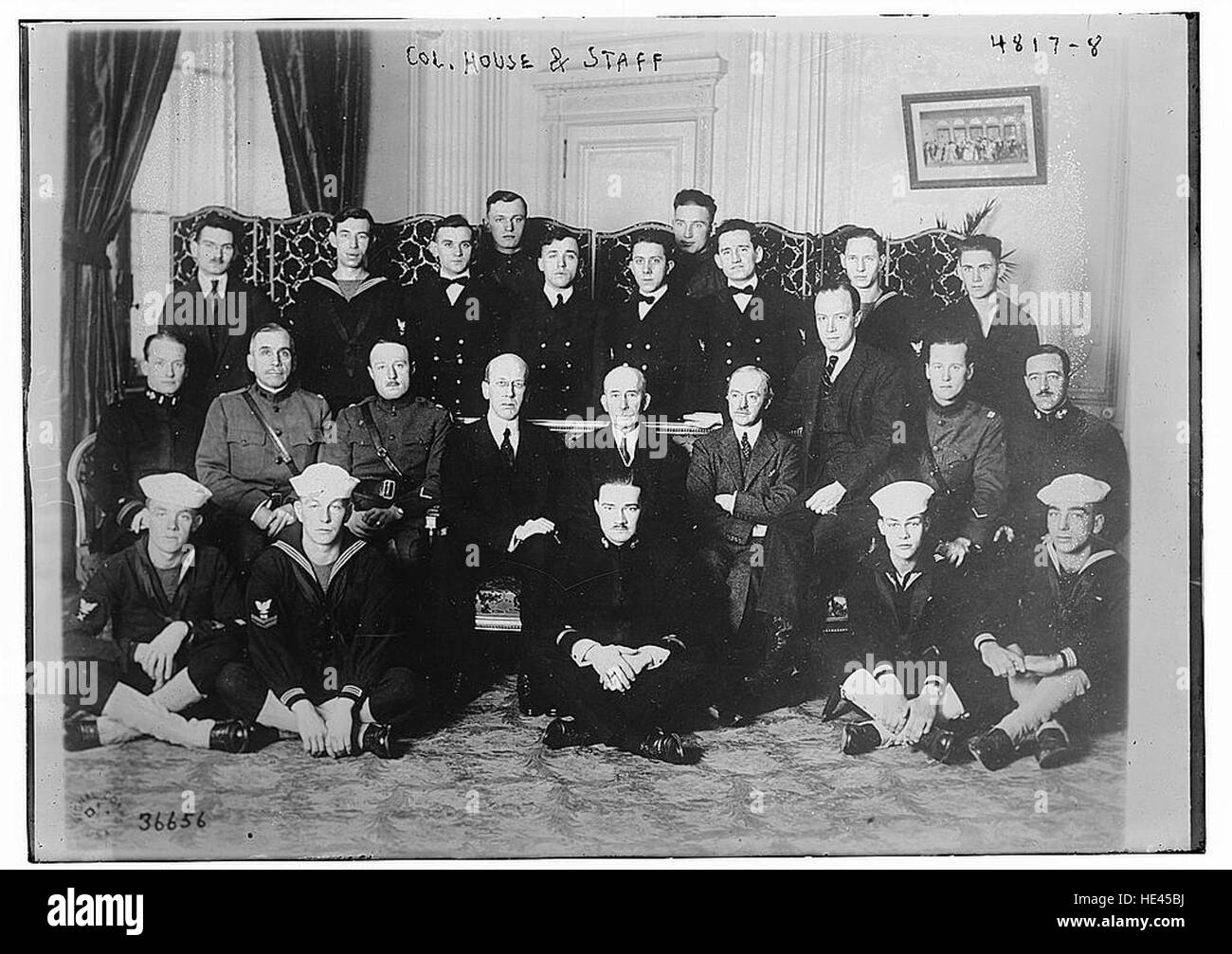 A historic image depicting the Col House and its staff, capturing a ...