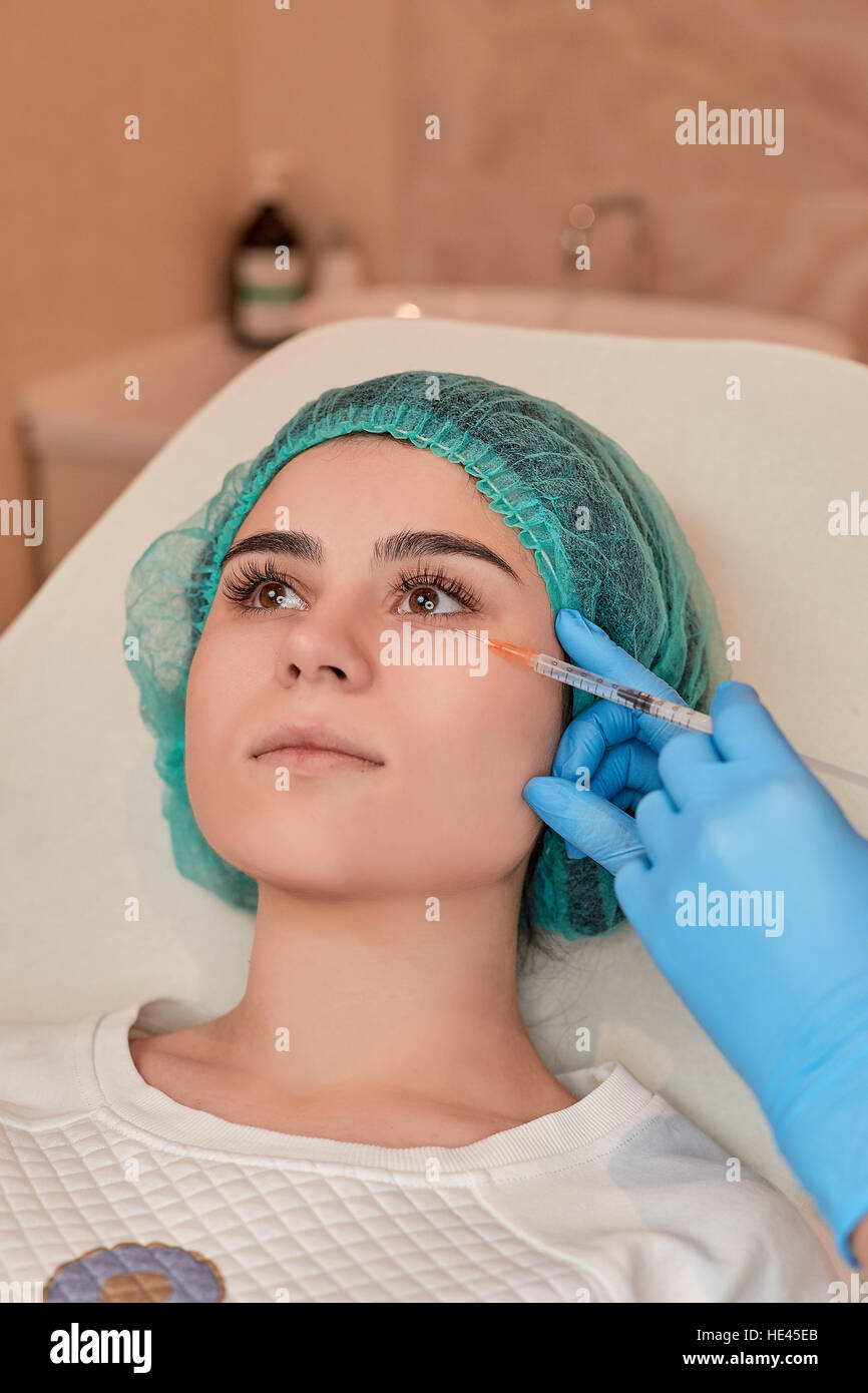 Beautiful woman gets injections Stock Photo - Alamy