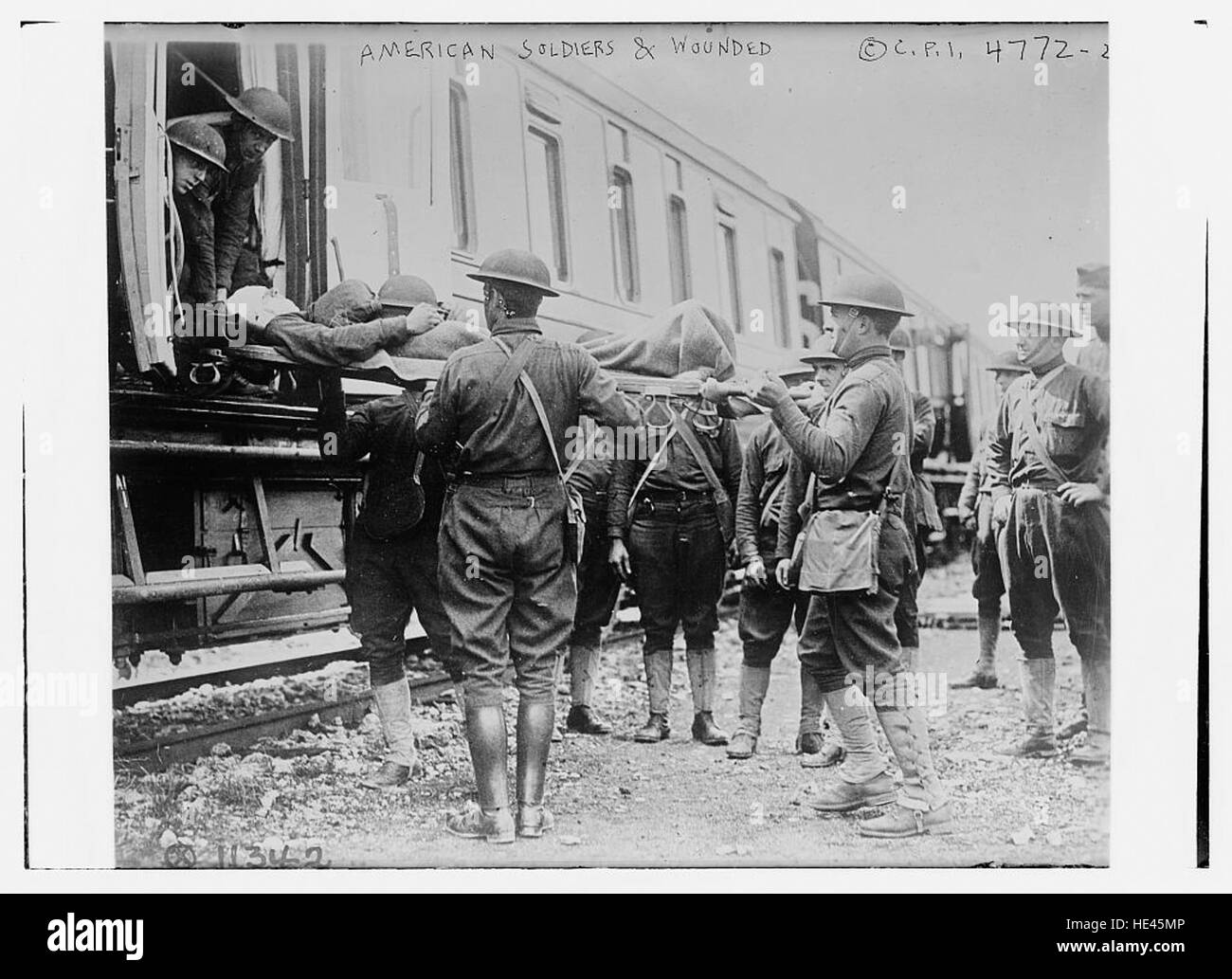 This image captures American soldiers and wounded personnel from a ...