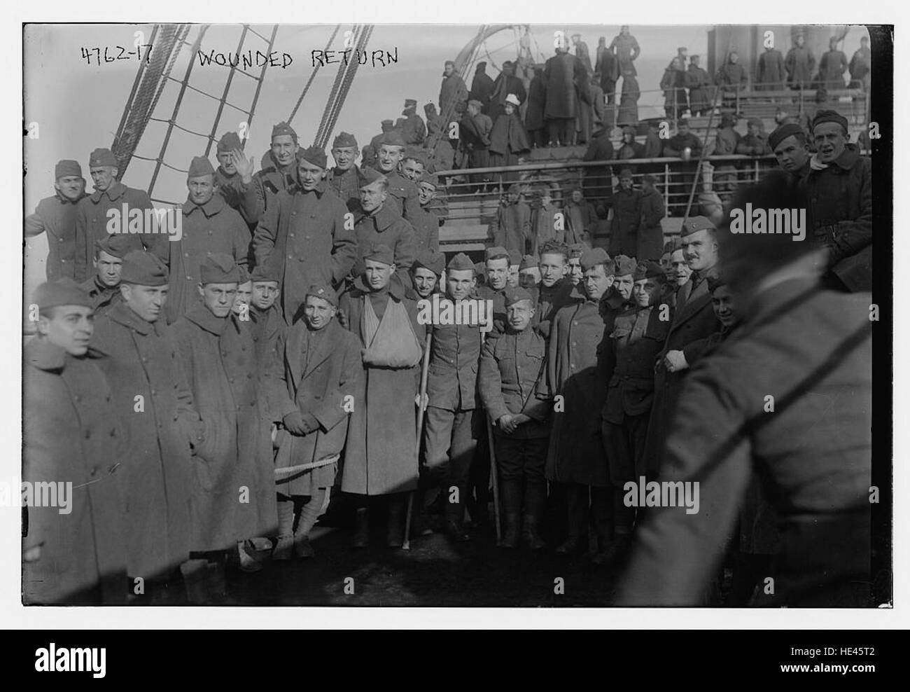 The image shows soldiers returning home after being wounded in battle ...