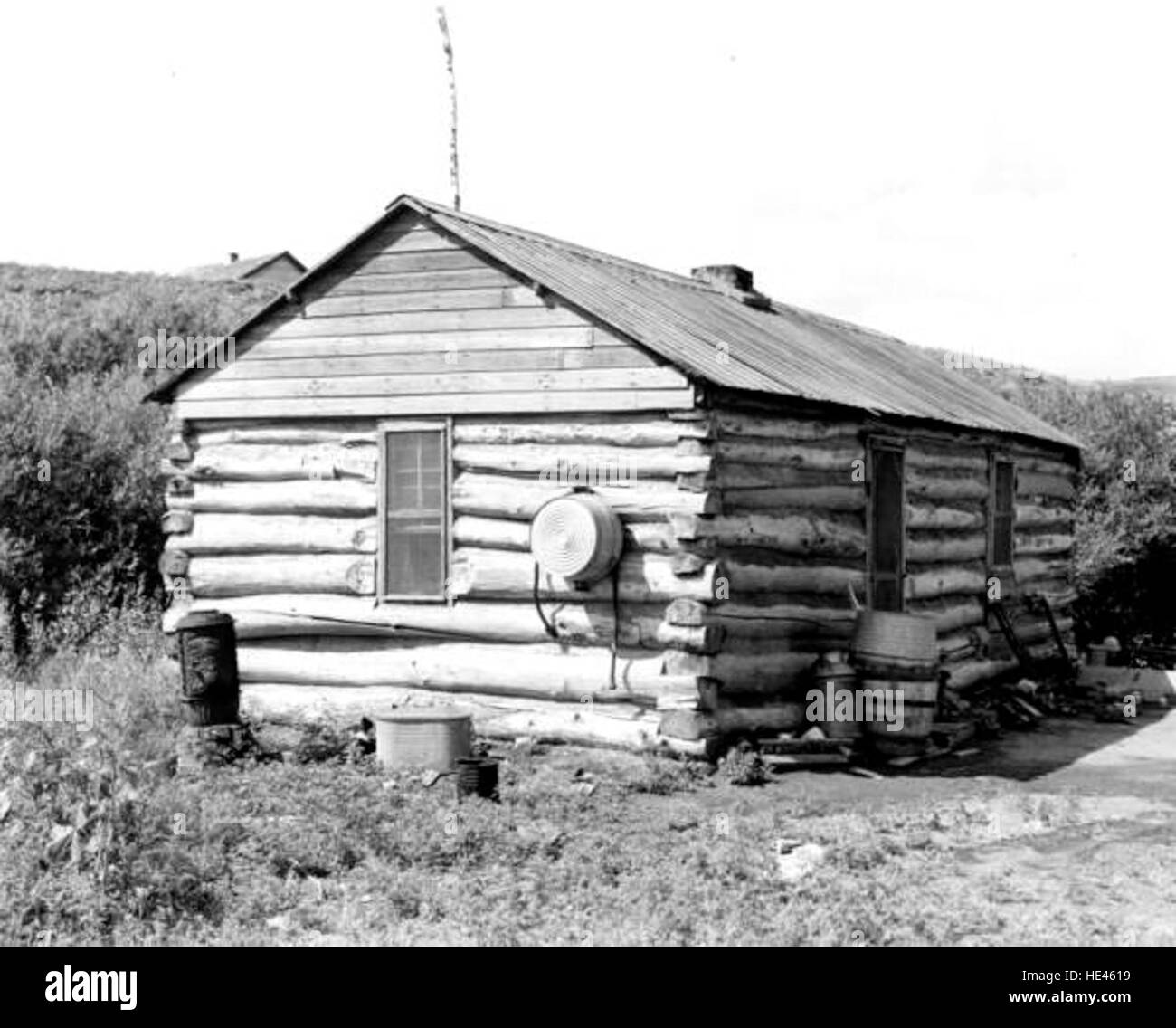 A historic photograph showing a dwelling used by migrant workers in the ...