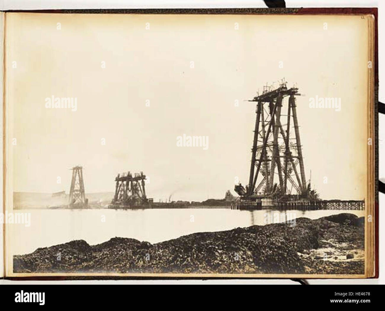 This historic image shows the construction of the Forth Bridge, one of ...