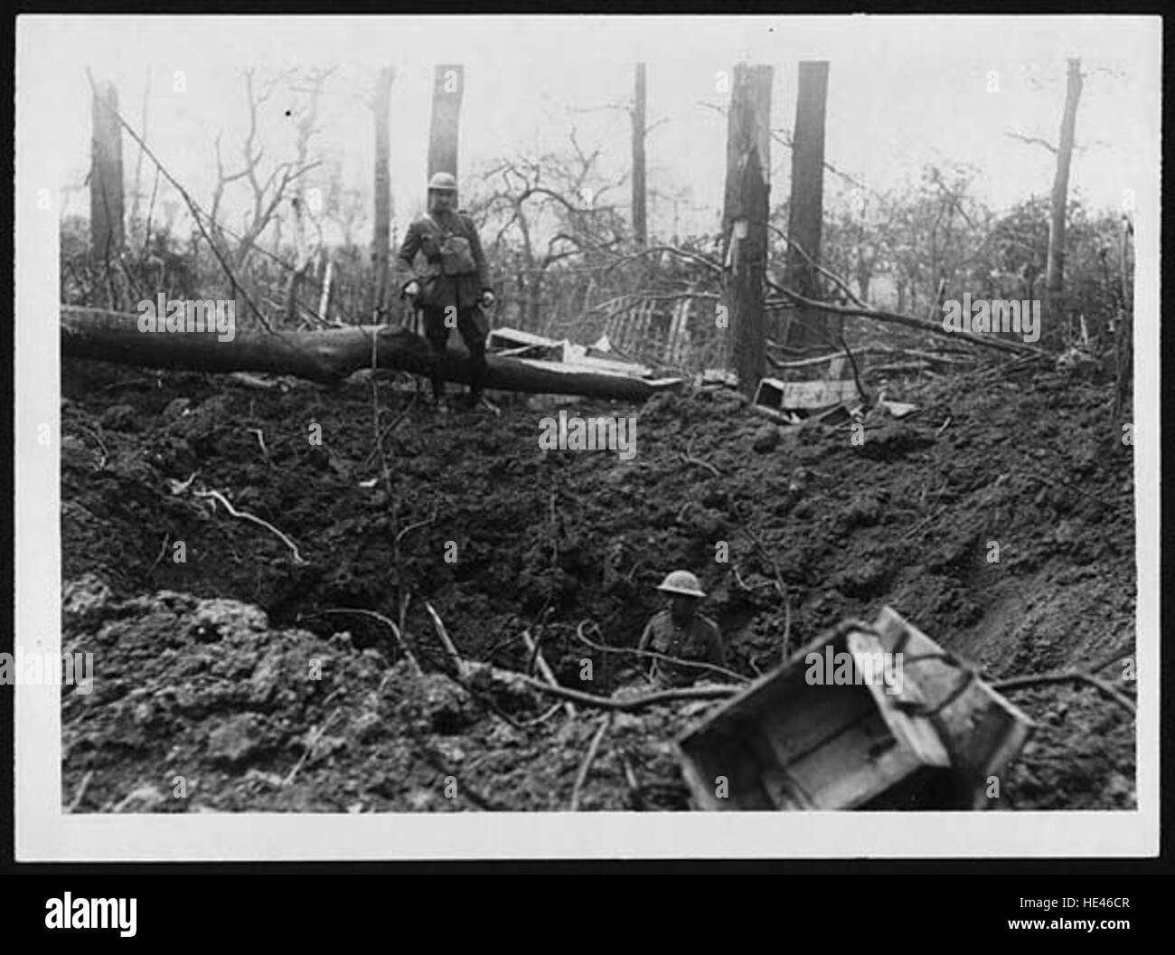 This image depicts the impact of a high explosive shell on the ground ...