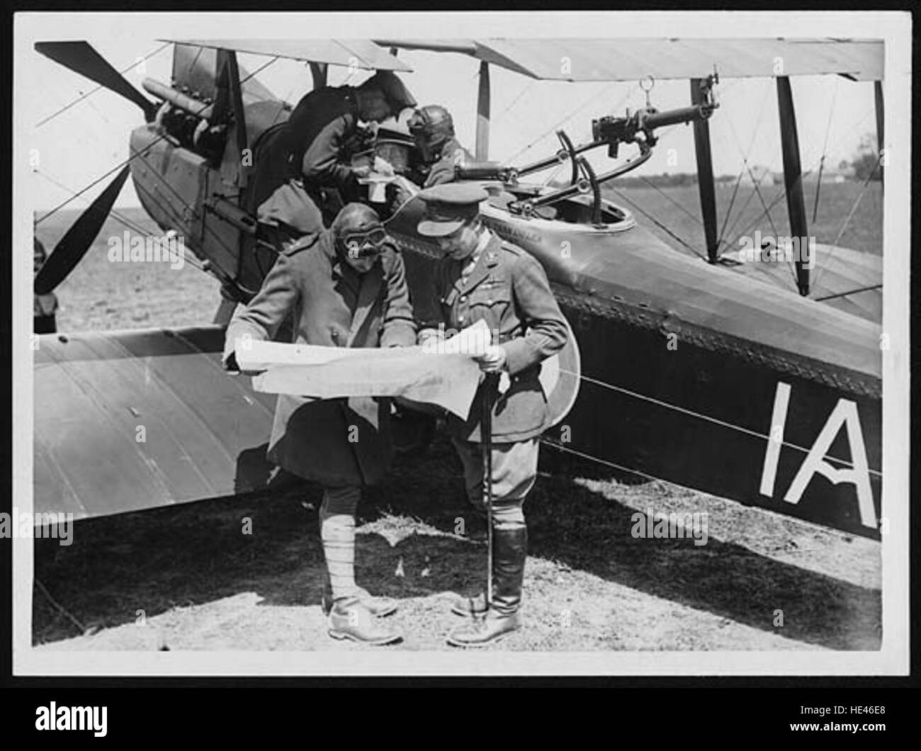 This historic photograph captures a pilot and an observer, a typical ...