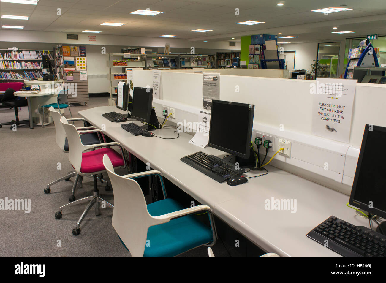 Interior of a library, West Yorkshire, England - desk with computers ...