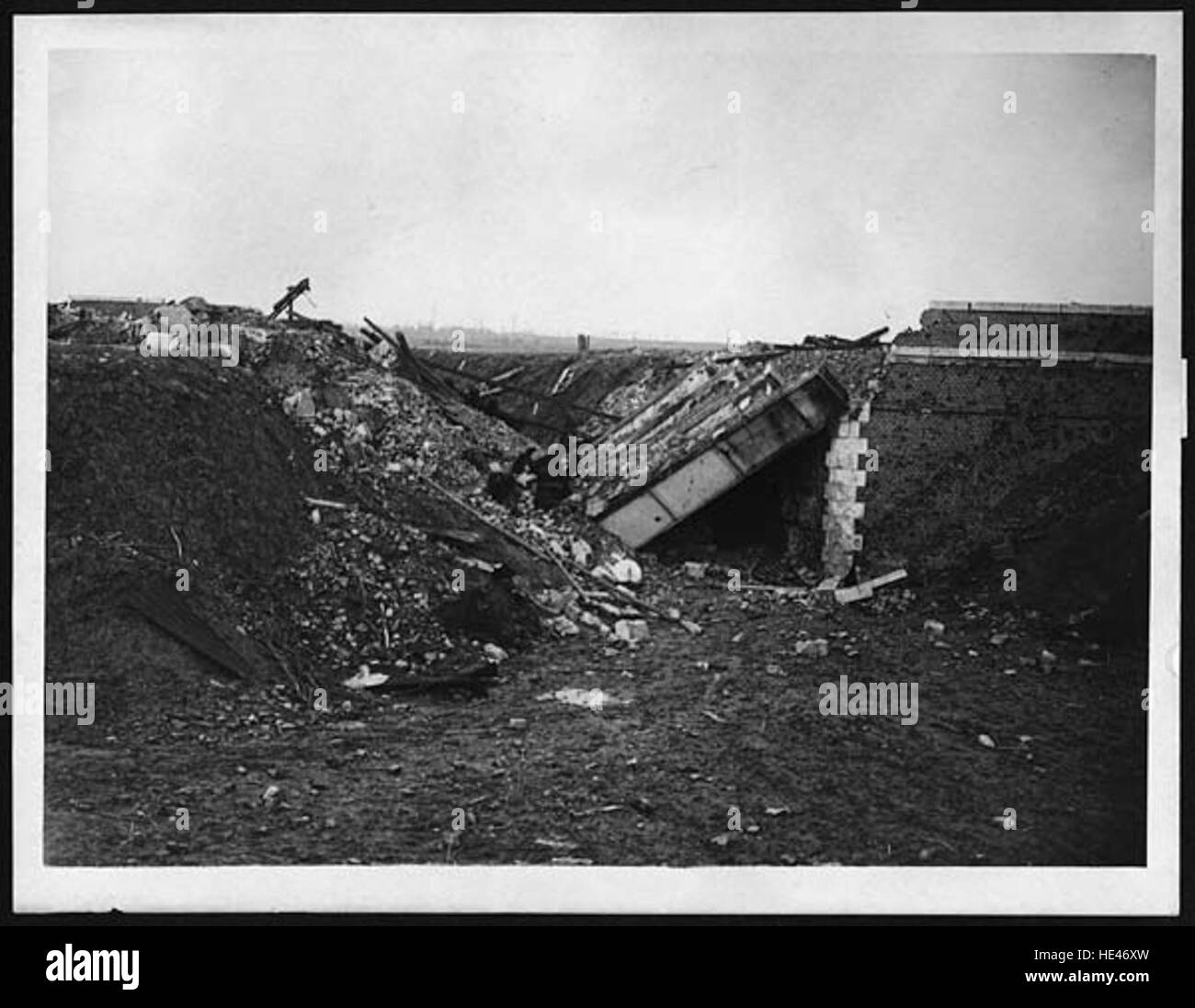 This historical image depicts the destruction of a railway bridge at ...