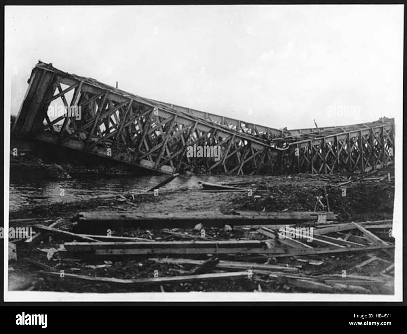 A historic photograph of a blown-up railway bridge across the Somme ...