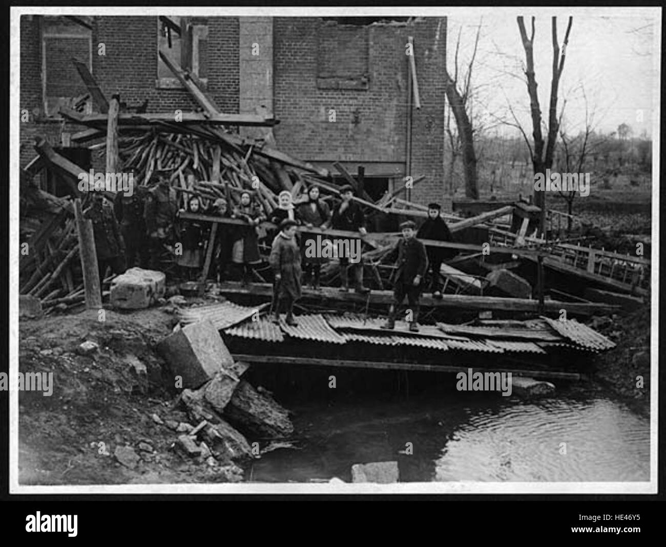 The image depicts the blown-up bridge at Nesle, France, a significant ...
