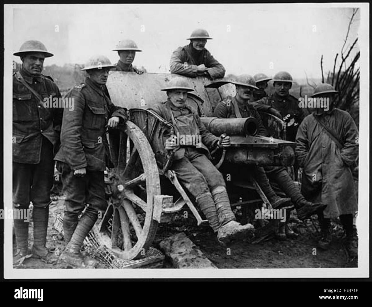 This historic photograph captures a group of gunners beside a captured ...