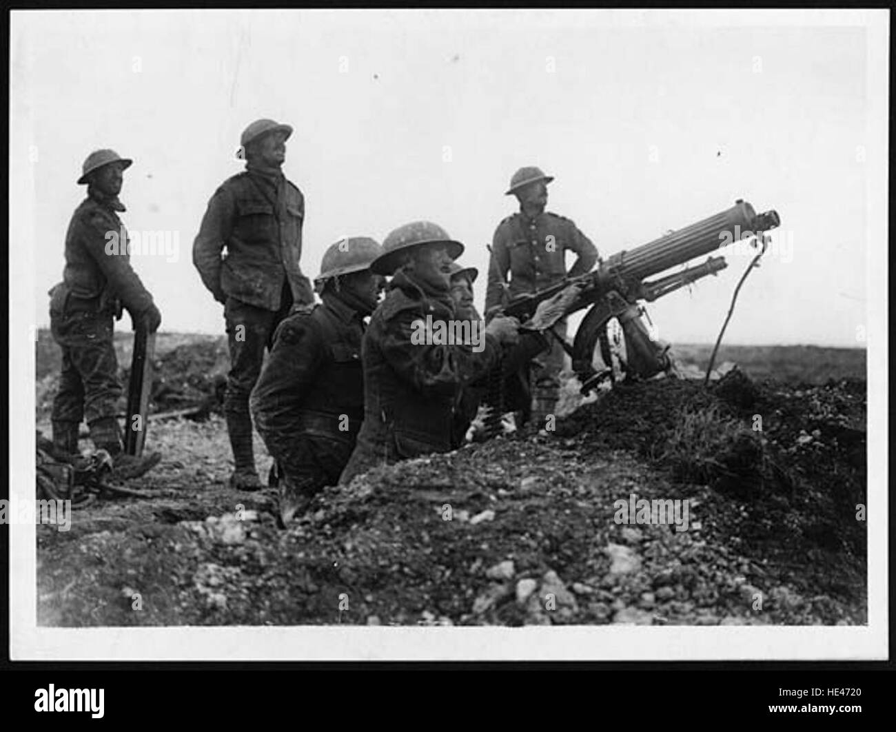 This historic image shows soldiers firing a Maxim gun at an aircraft ...