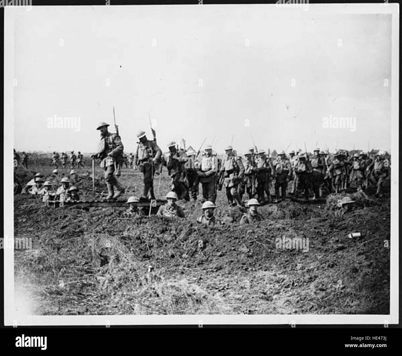 A historic image showing infantrymen in military formation, advancing ...