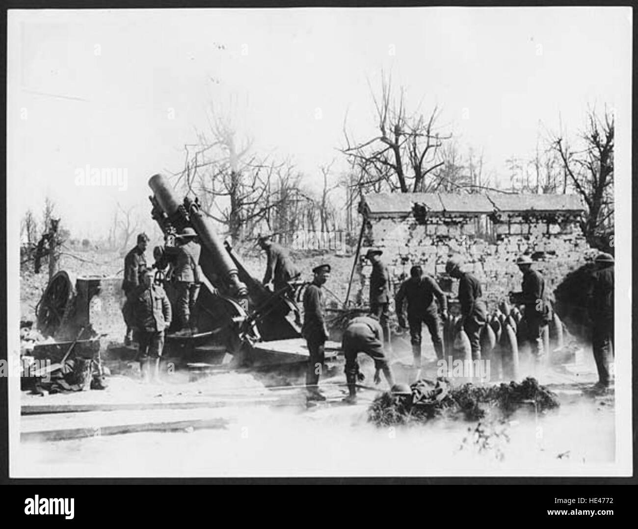 This historical image depicts a howitzer artillery piece bombarding ...