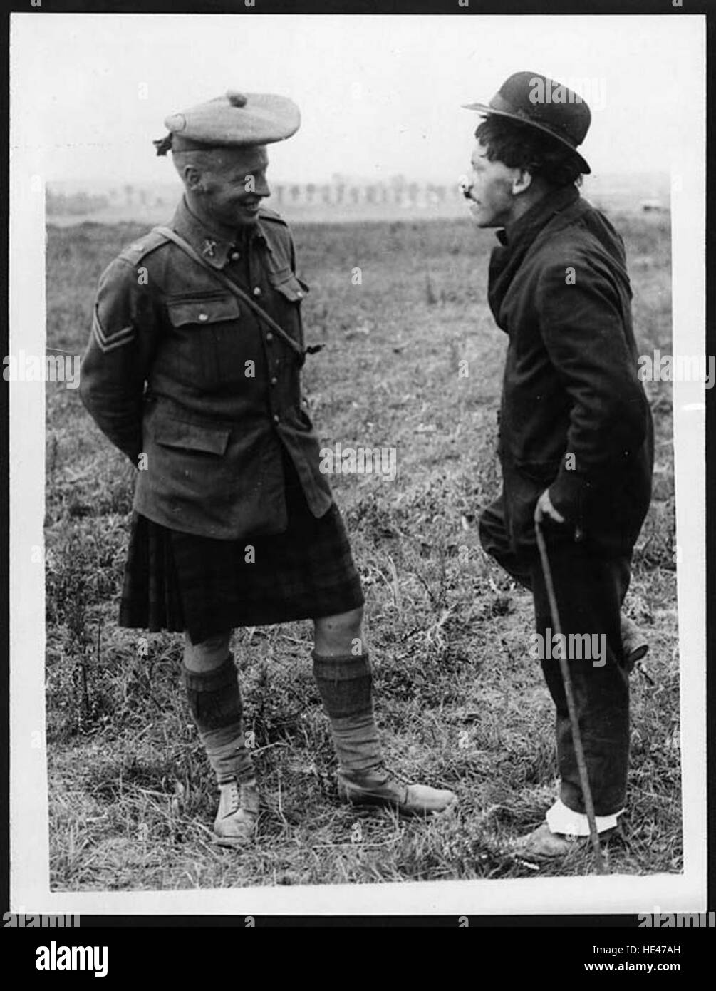 This historic image captures Charlie Chaplin engaging in conversation ...