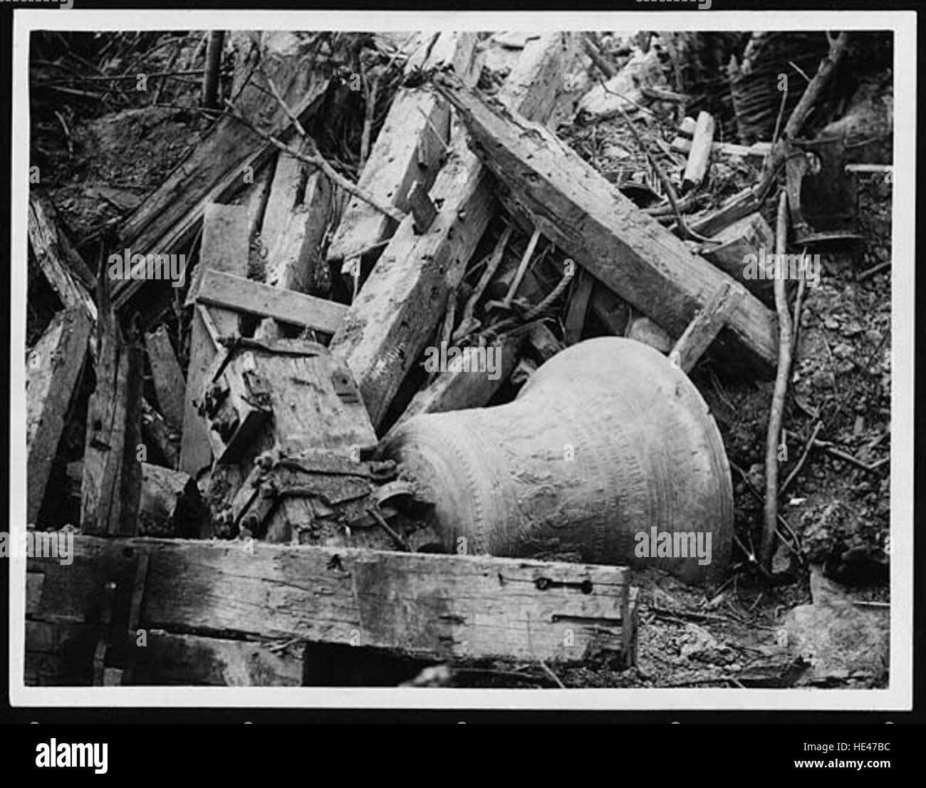 This historical photograph shows a bell in a German trench near Grande ...