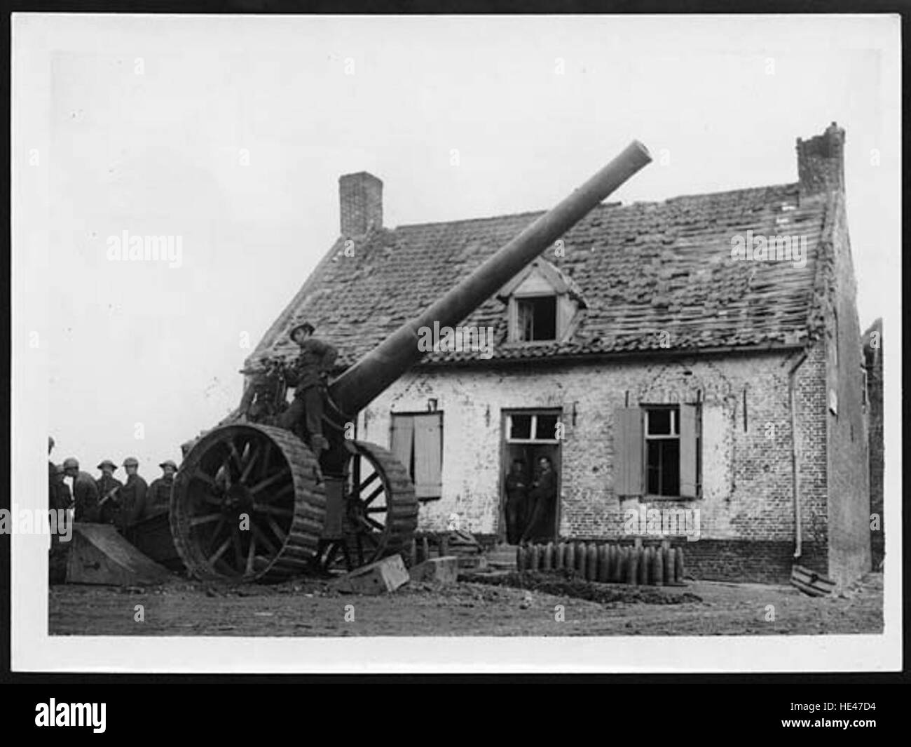 This historic image shows the operation of positioning a large ...