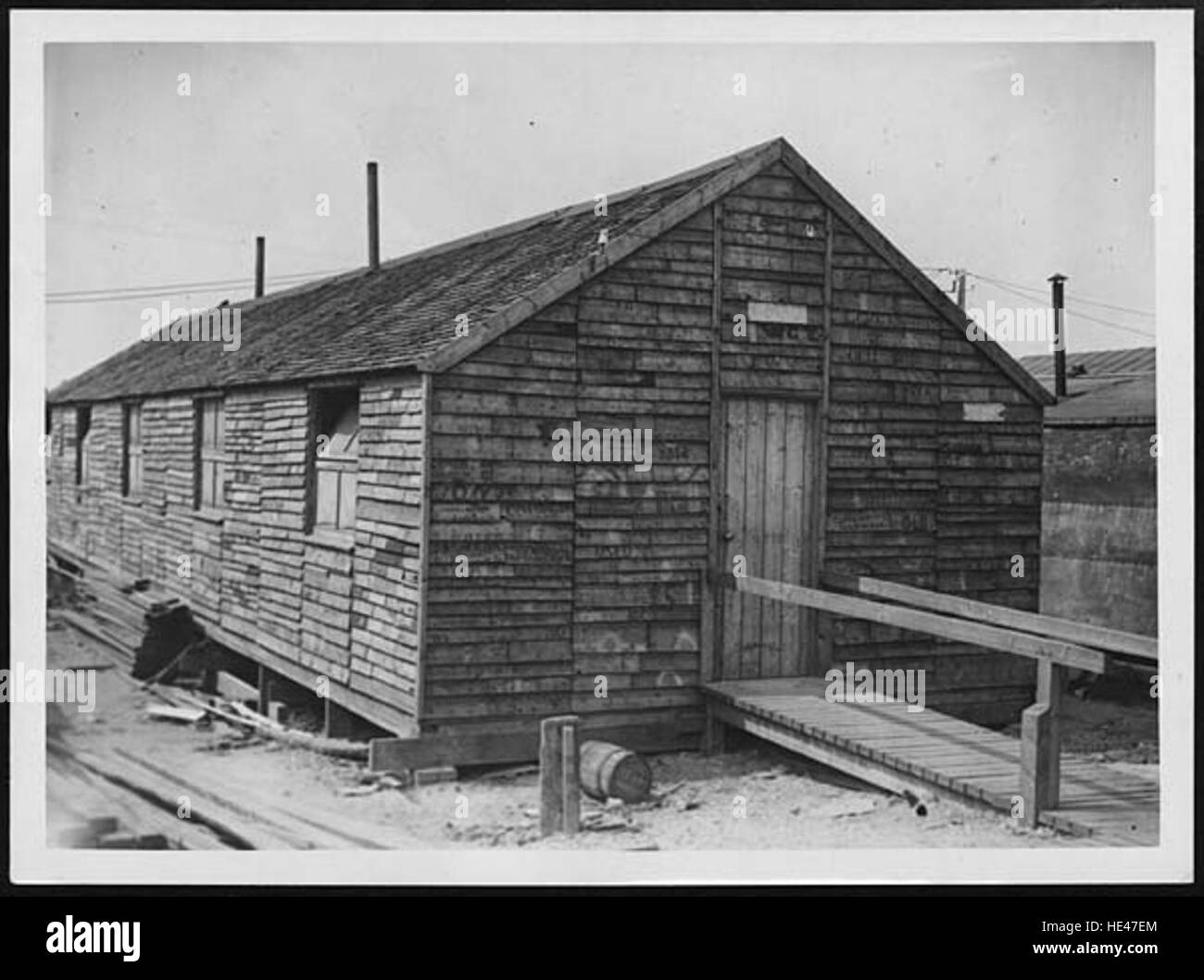 This historical image shows a hut constructed entirely of old boxes by ...
