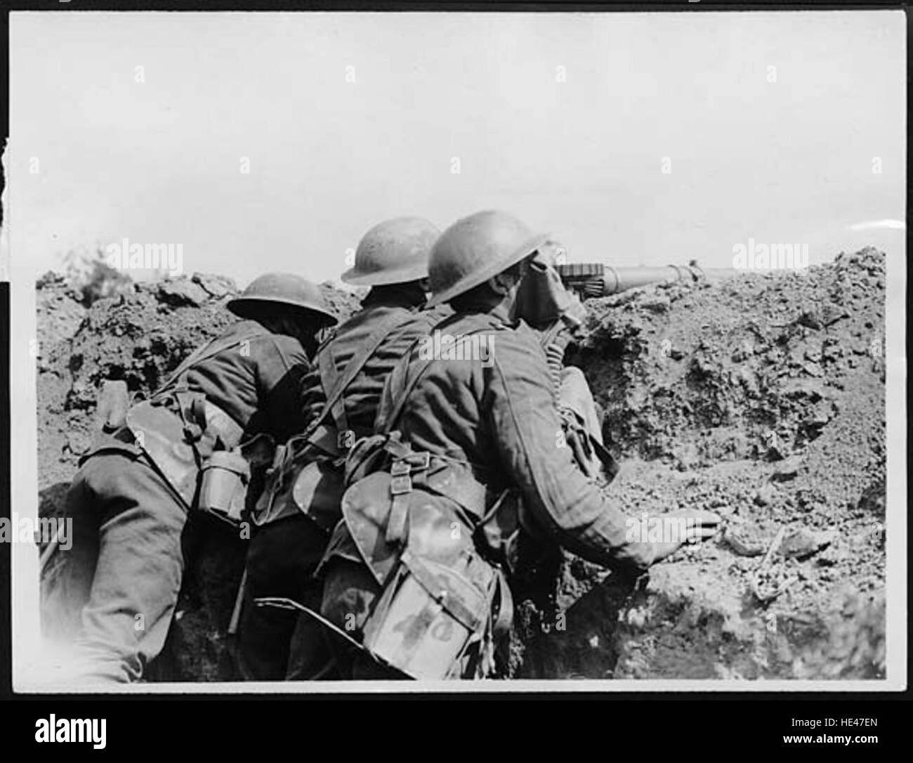 The image shows a Lewis gun crew prepared for action on the front line ...