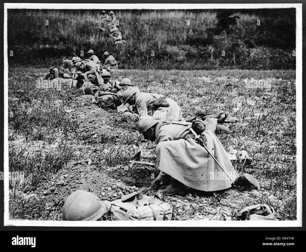 This historical image depicts soldiers during a military conflict ...