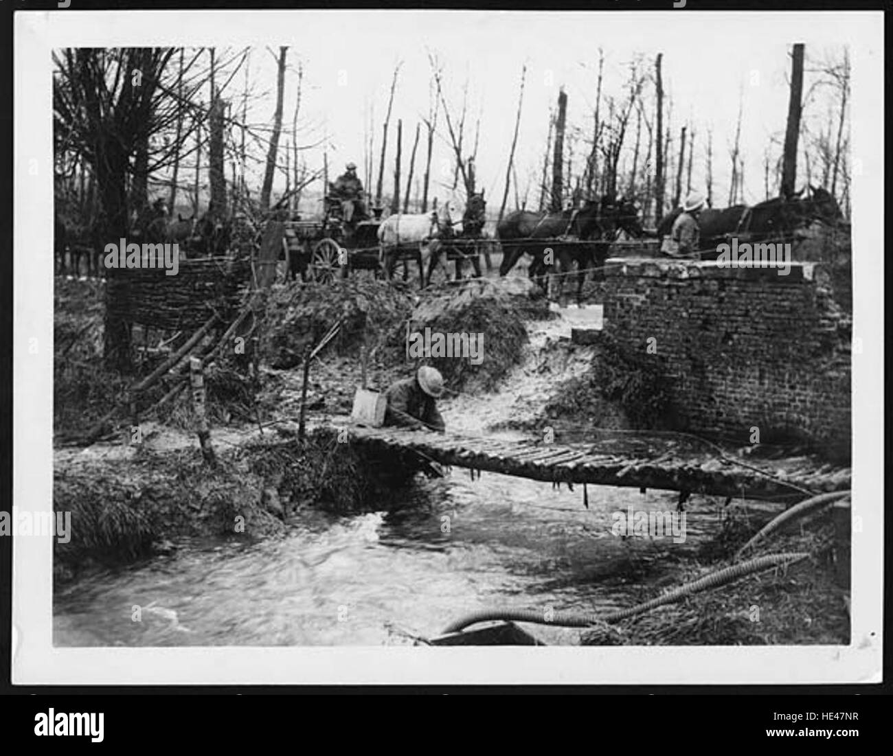 This historical image depicts a water refilling point from an earlier ...