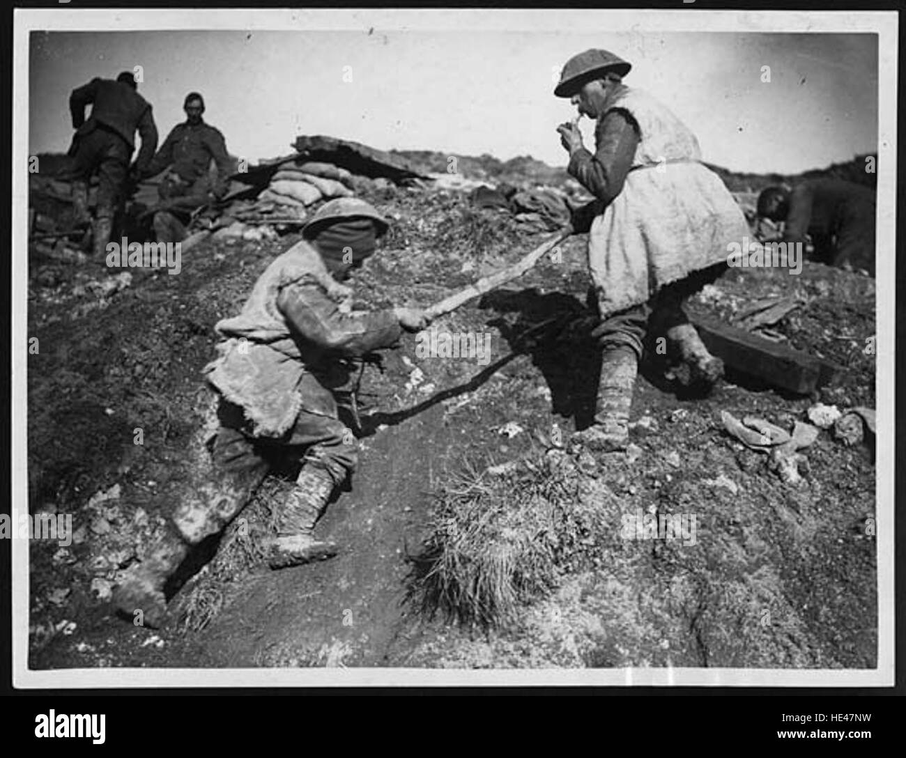 This historical image shows soldiers going up to their dug-out during ...