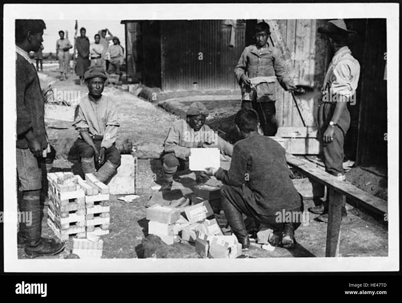 This historic image portrays the issuing of soap and cigarettes ...