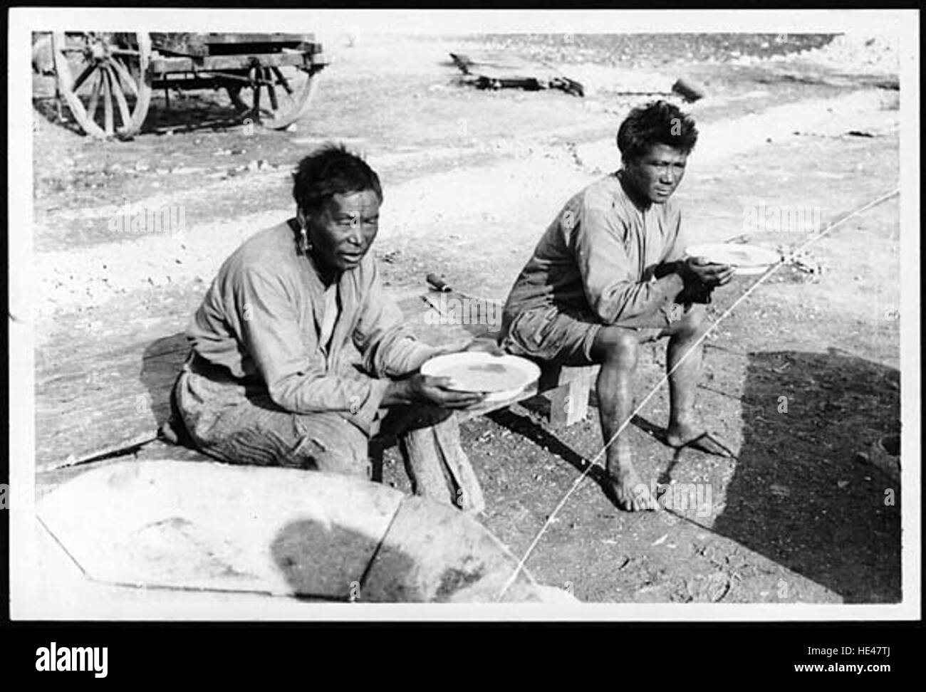 This image portrays two natives of Manipur sharing a meal, reflecting ...