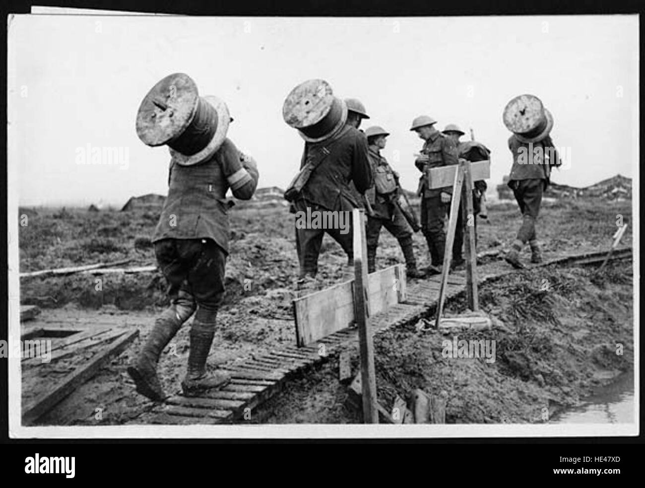 The image depicts the installation of a telegraph wire in No Man's Land ...