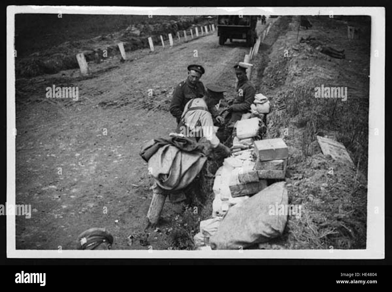 An image depicting the historic scene of sorting mail by the roadside ...