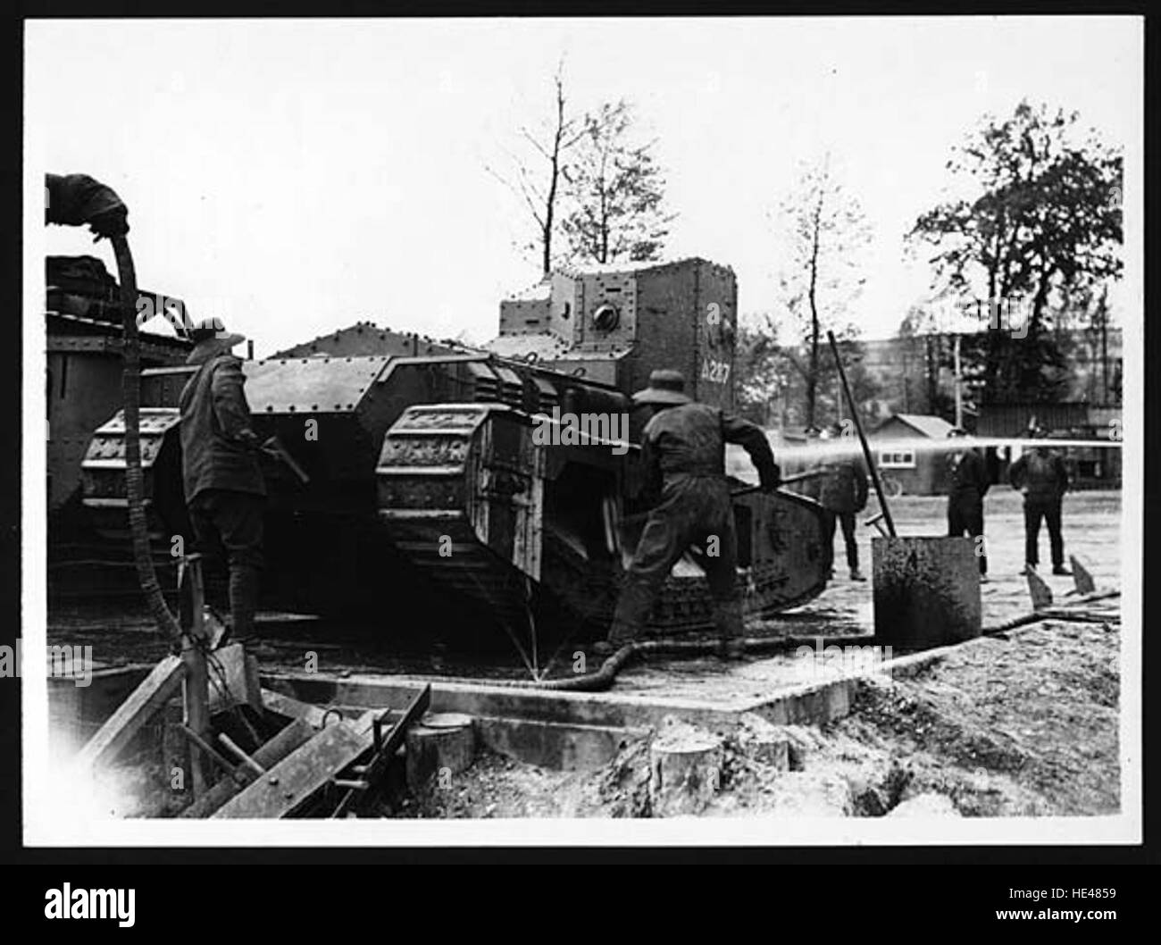This historical image depicts the process of washing down a Whippet ...