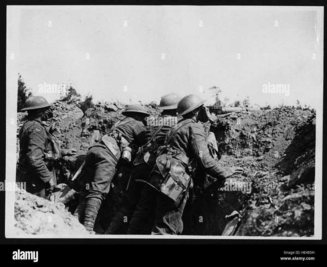 This historical image shows a Lewis gun crew positioned at the front ...