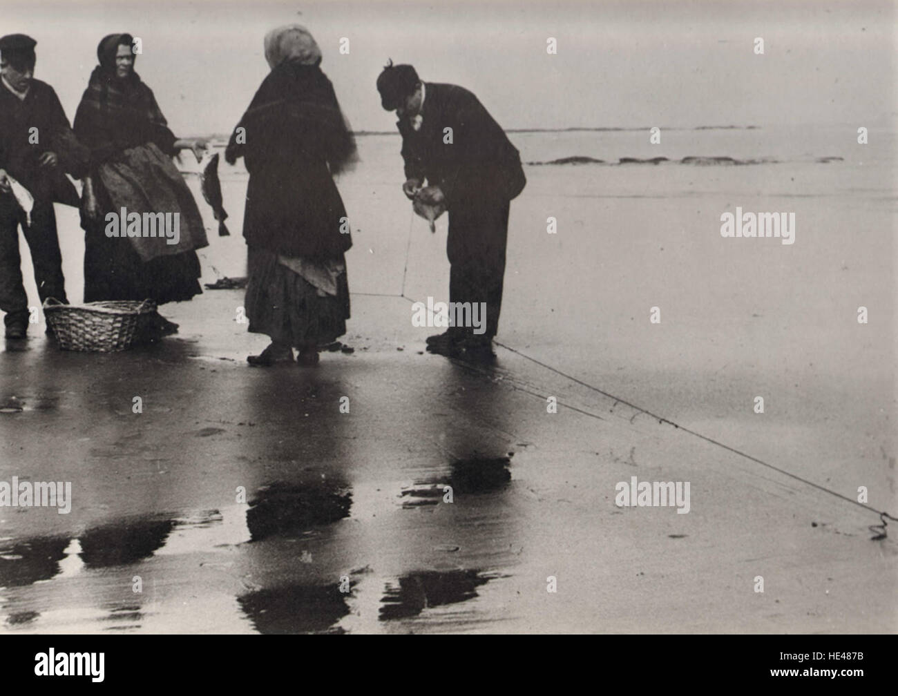 This historical image, depicting a fishwife clearing fishing lines in ...