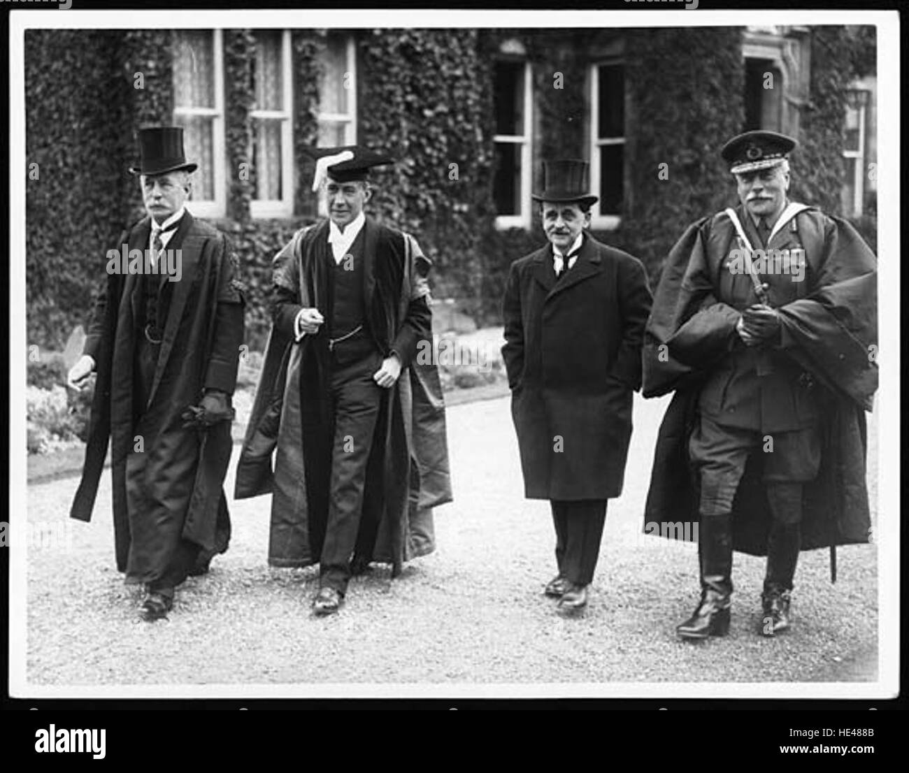 This historic photograph features Mr. Younger, the Principal, alongside ...