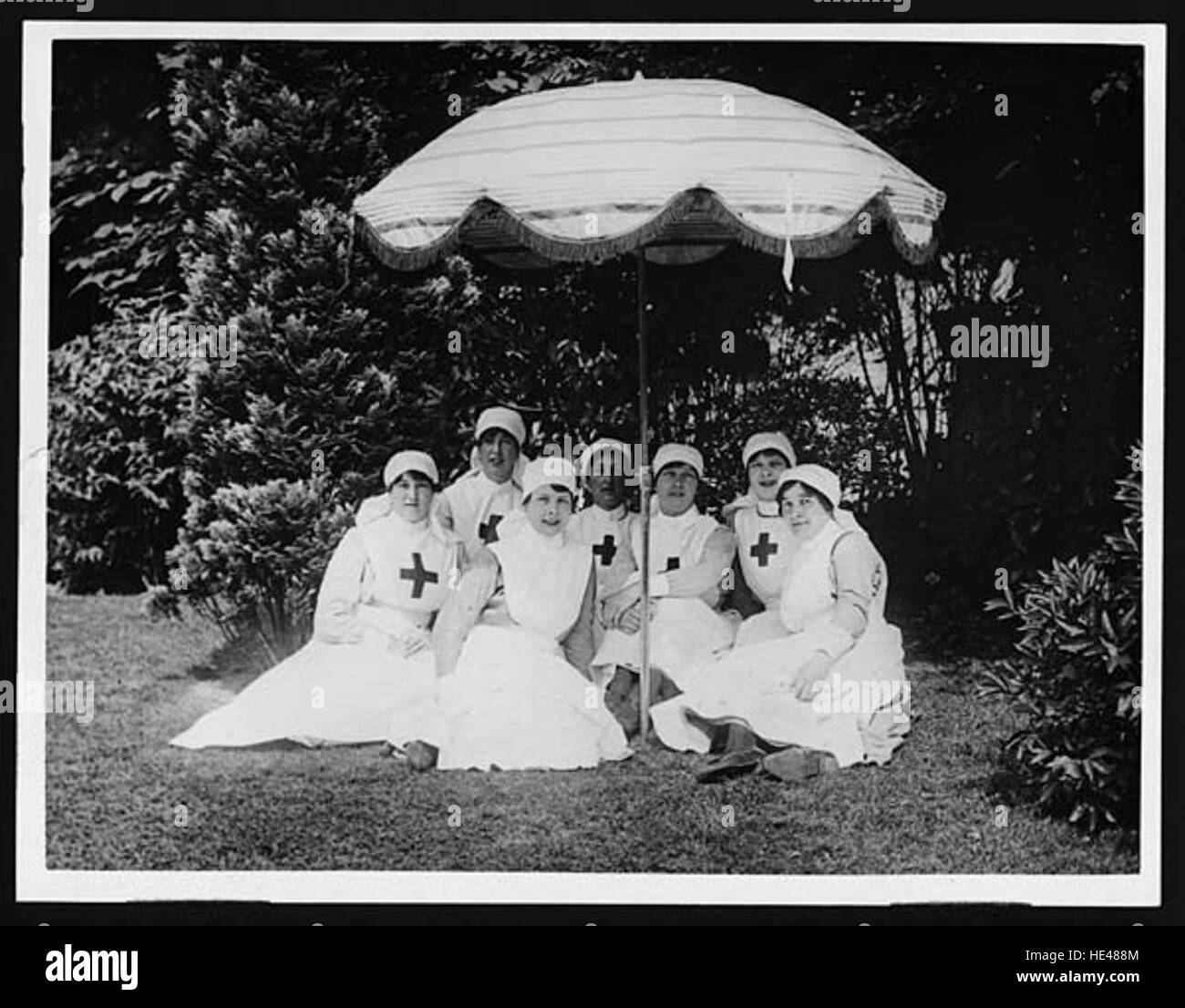 This photograph captures a historical moment when nurses, dressed in ...