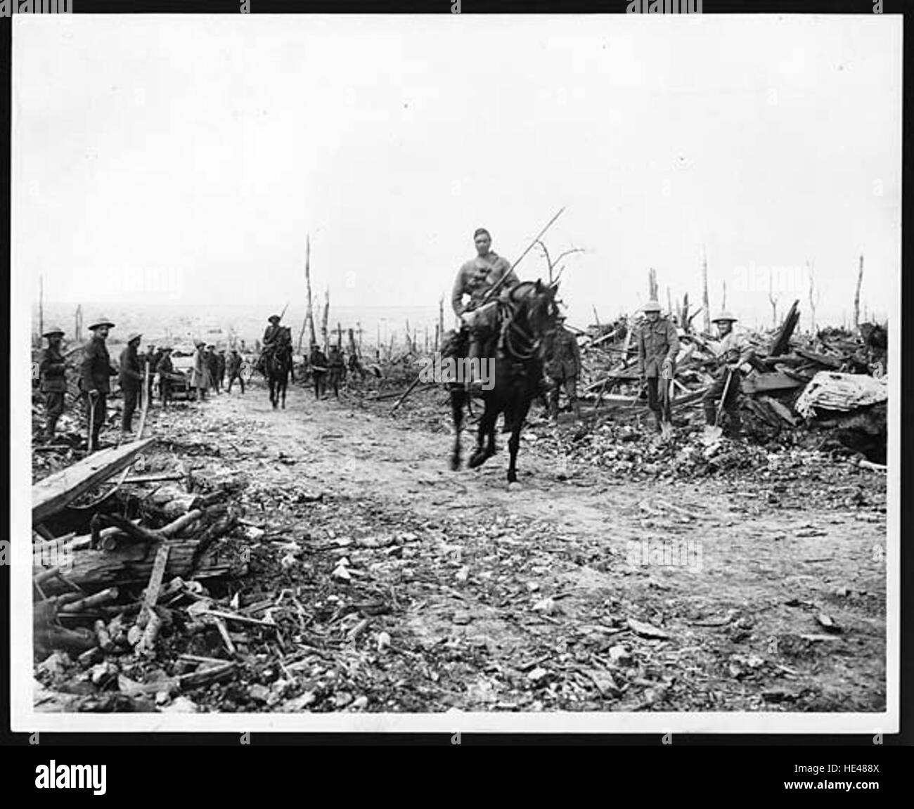 This image features a historical depiction of cavalry with spears ...