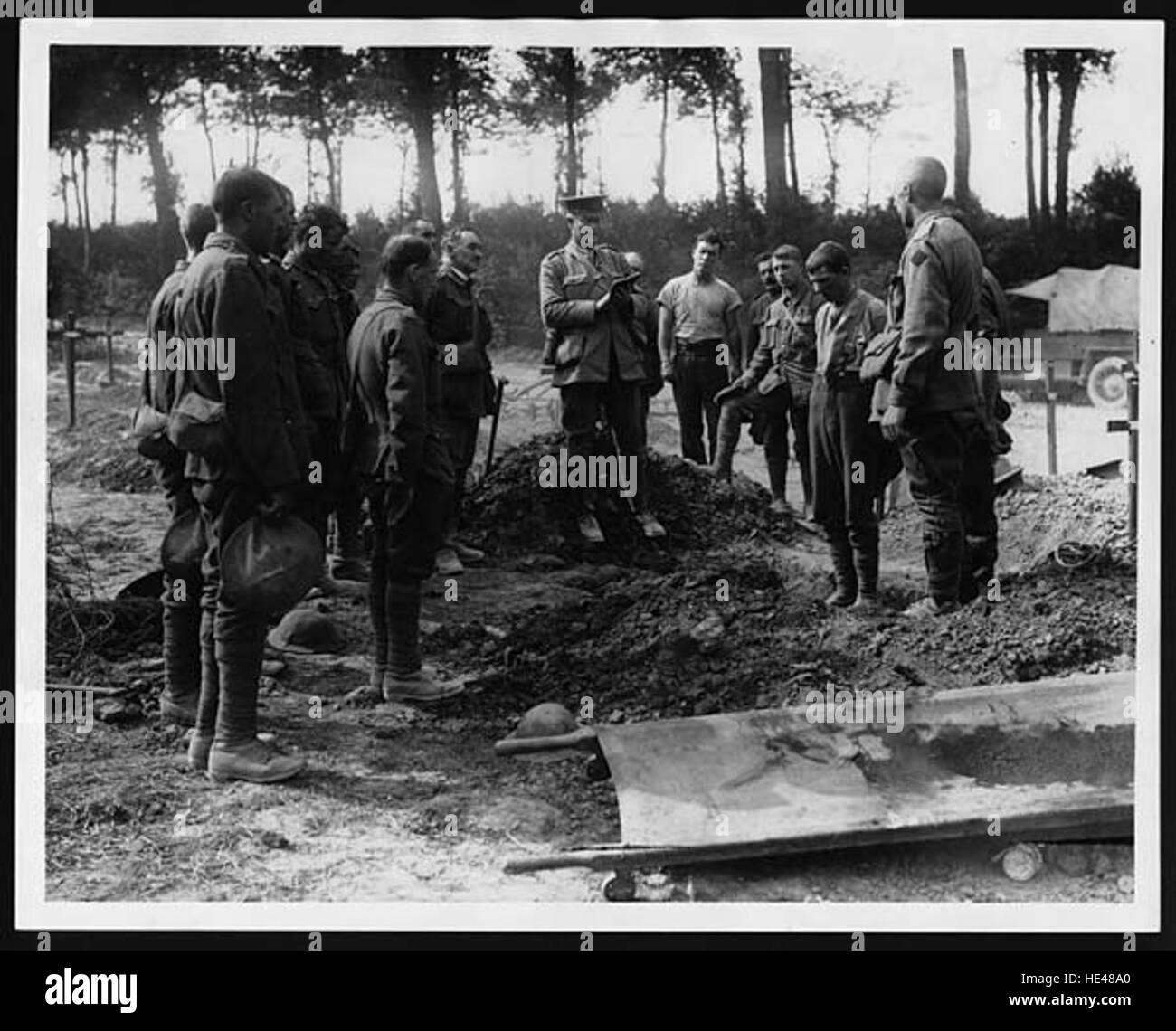 This historical image captures the solemn funeral of an ANZAC soldier ...