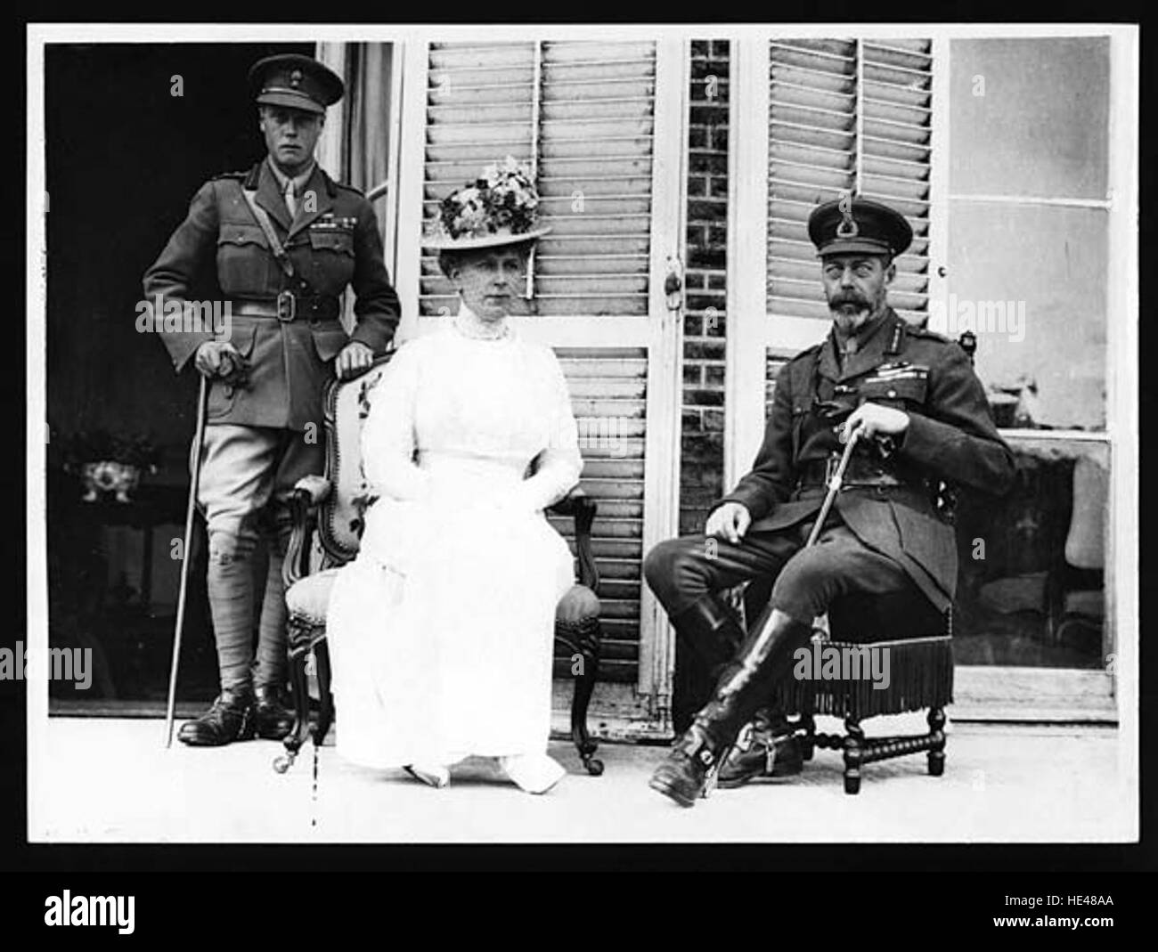 A historic image depicting a royal family, including the King, Queen ...