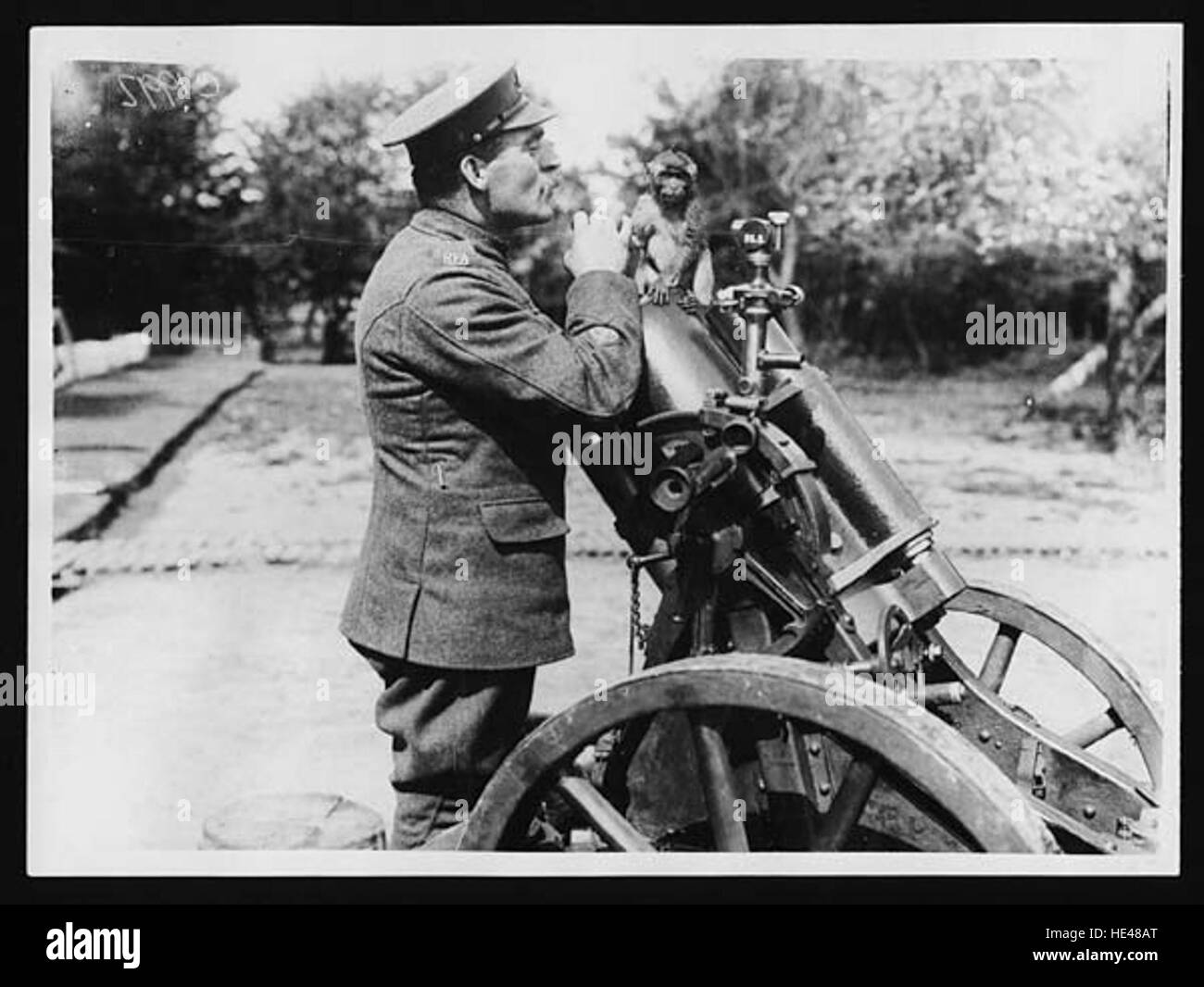 This historical photograph shows a trench mortar school mascot, likely ...