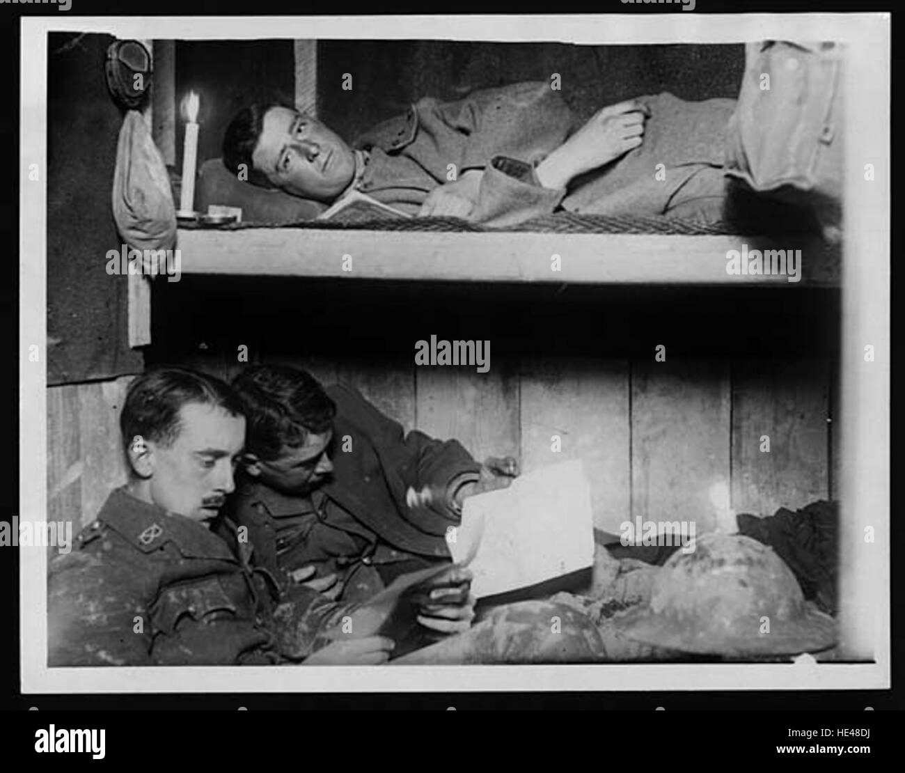This historical photograph depicts life inside a German dugout ...