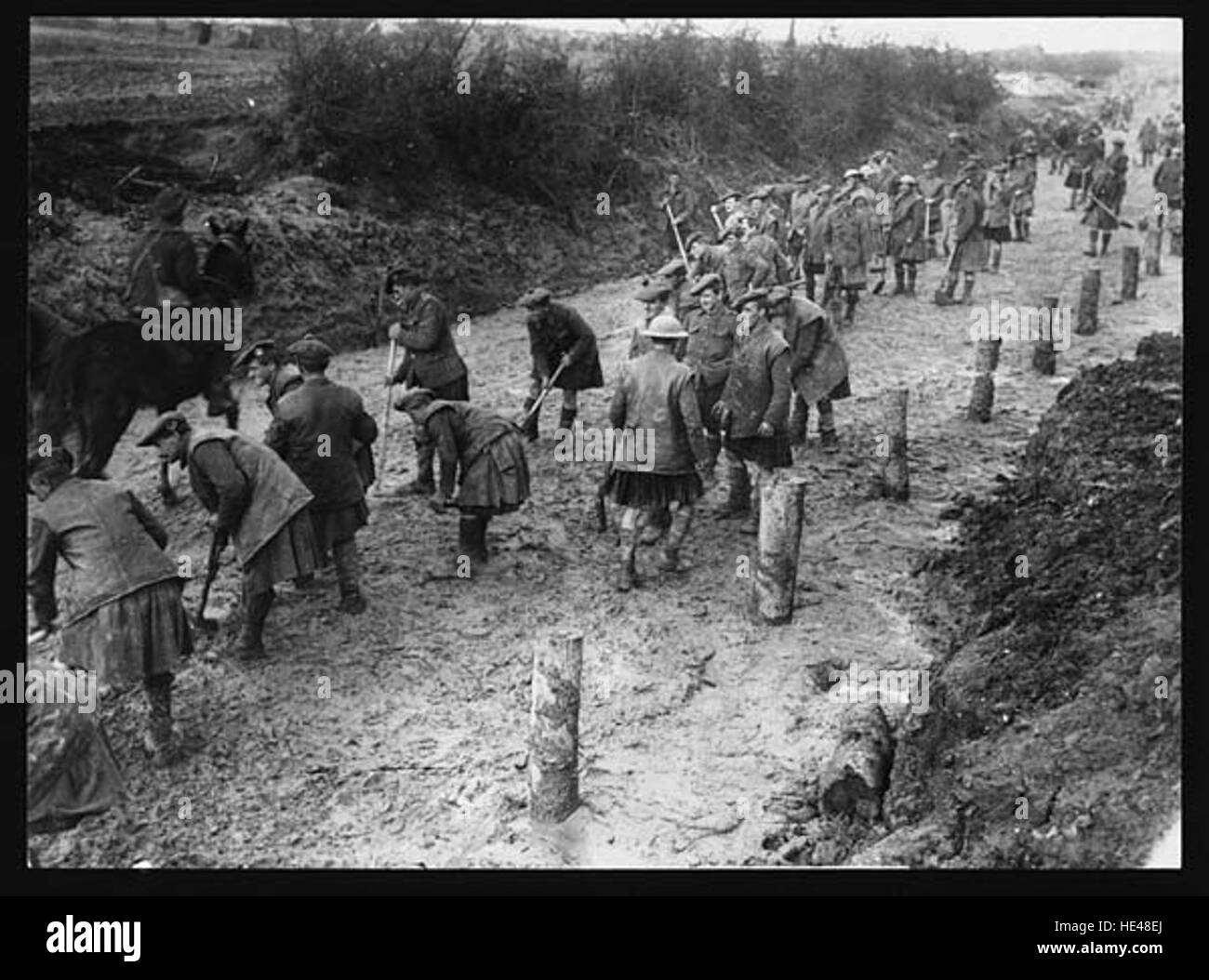 This historic image depicts Scottish Highlanders working on the roads ...