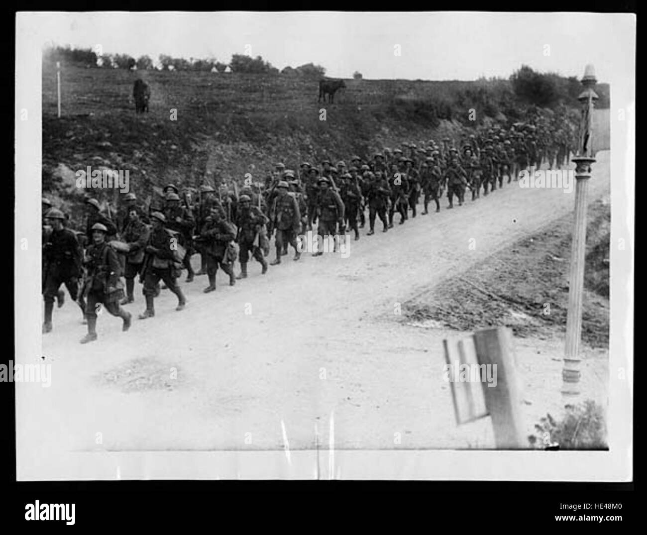 A historic photograph of troops emerging from the trenches after a ...