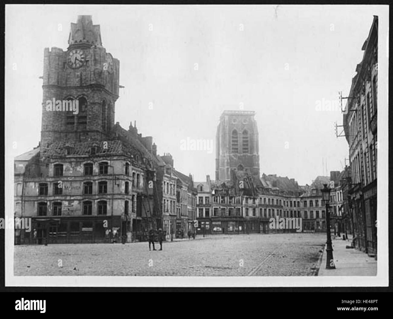 The Grande Place in Béthune, France, features a historic clock tower ...