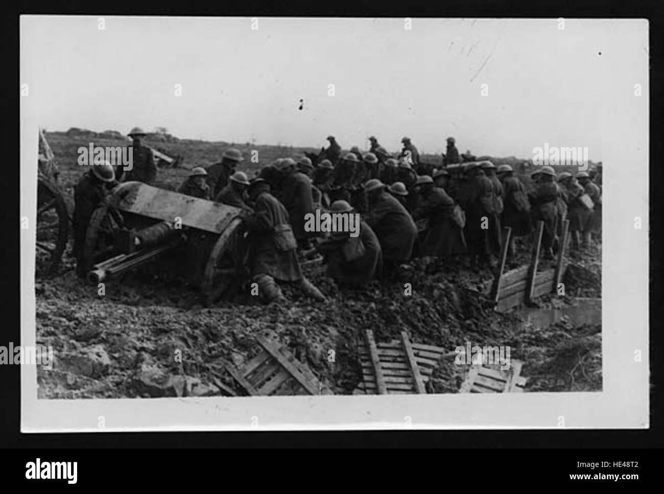 This historical image shows a field gun in difficulties during an ...