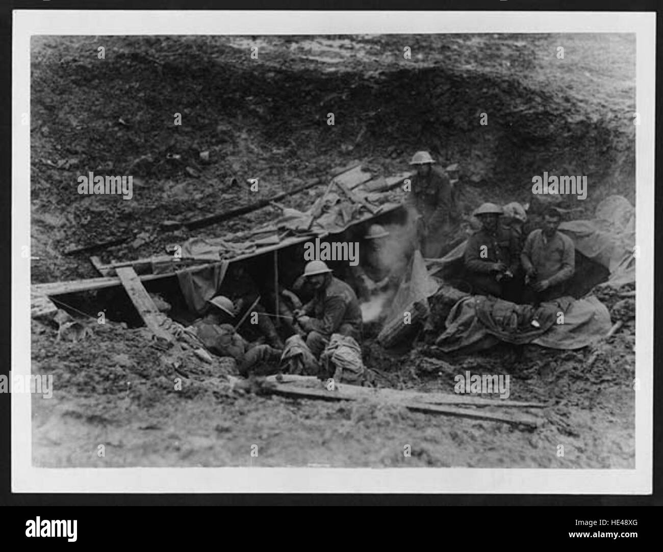 An image depicting men in a shell hole, taken 5 kilometers beyond a ...