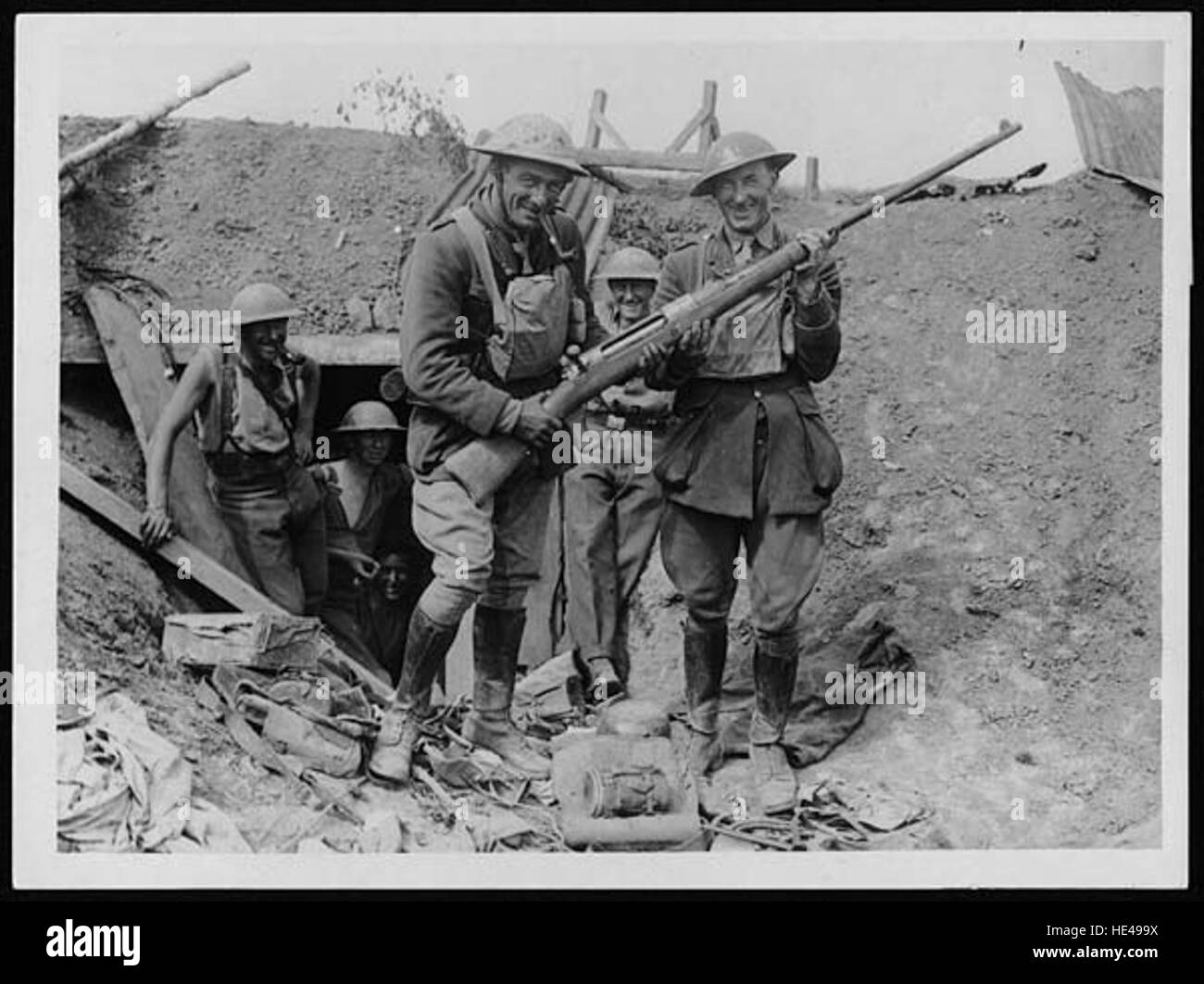 This historical photograph shows two officers posed with a German anti ...