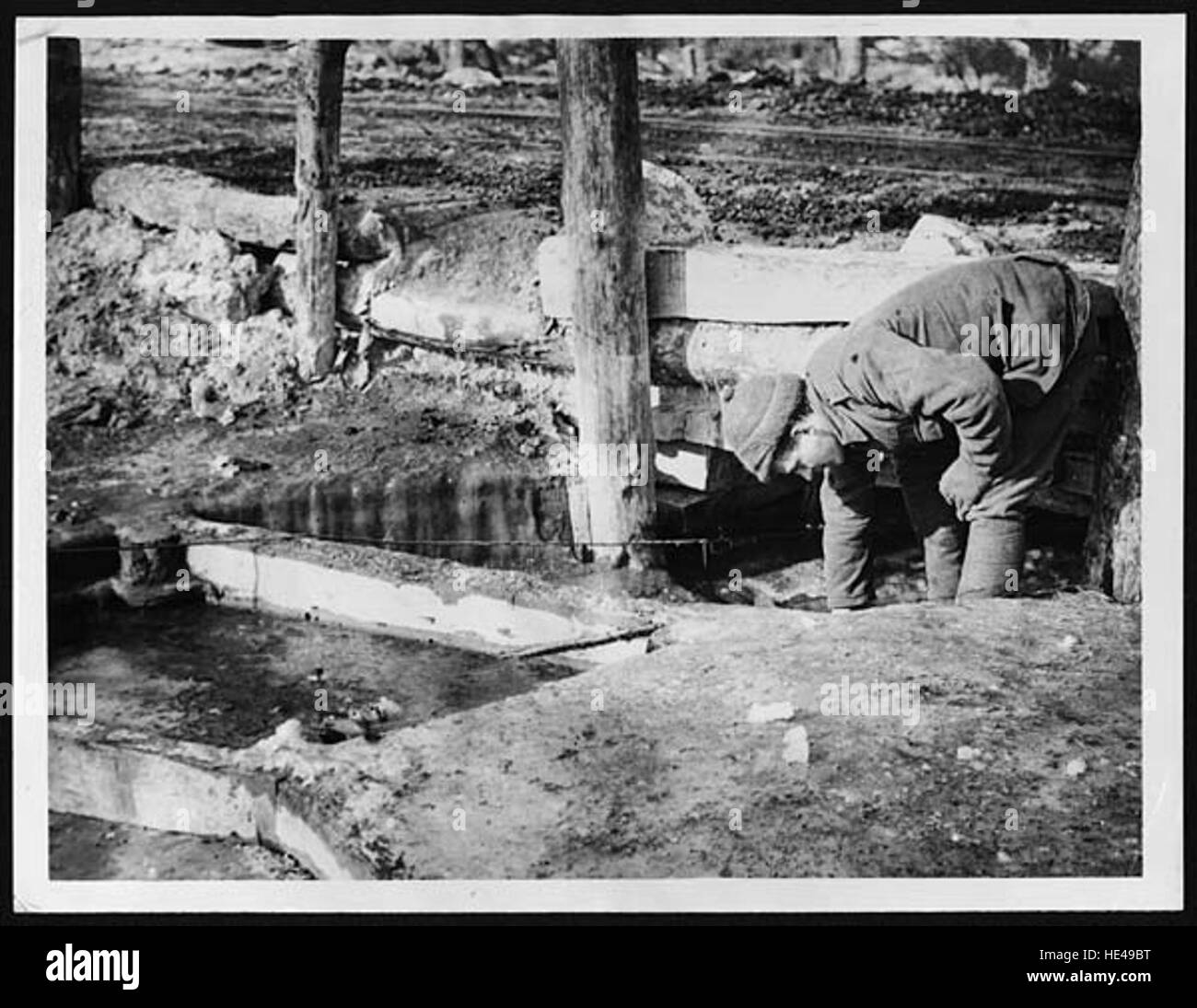 This image portrays individuals searching for water holes in thick ice ...