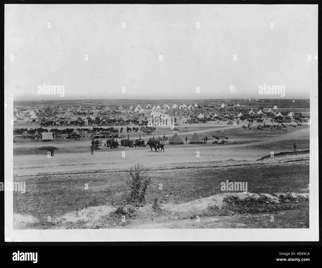 This historic photograph captures a scene from one of the military ...