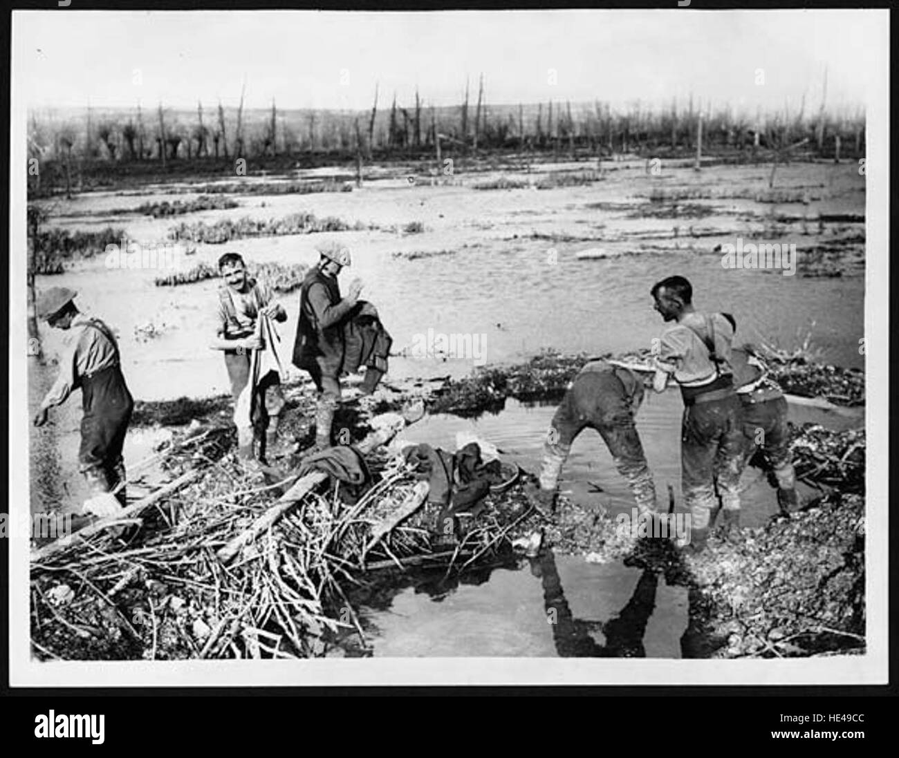 This historic image depicts soldiers washing and brushing up in the ...