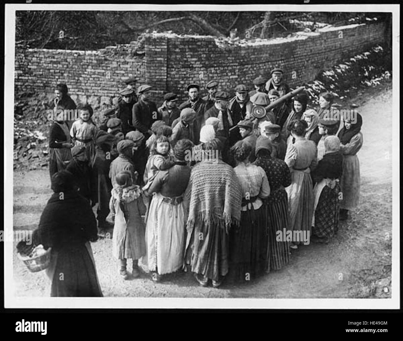 This image illustrates the inhabitants of a newly captured village ...